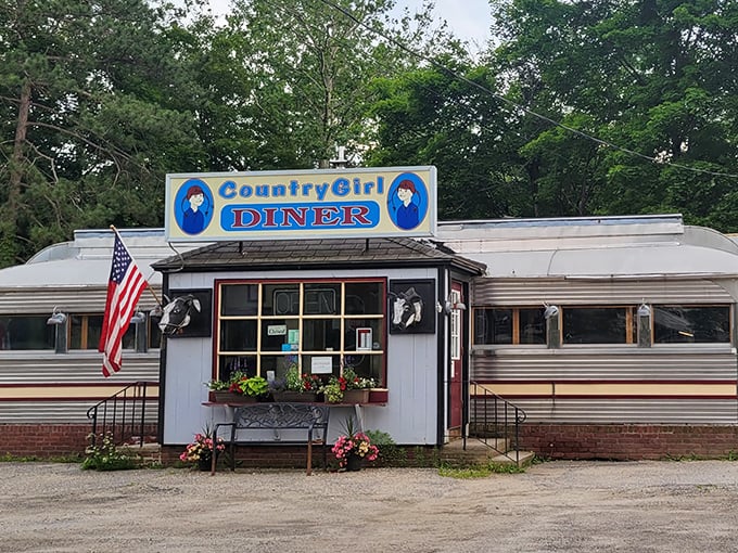 The blue sign beckons like an old friend on a Vermont highway. This classic roadside diner promises comfort and conversation in equal measure.