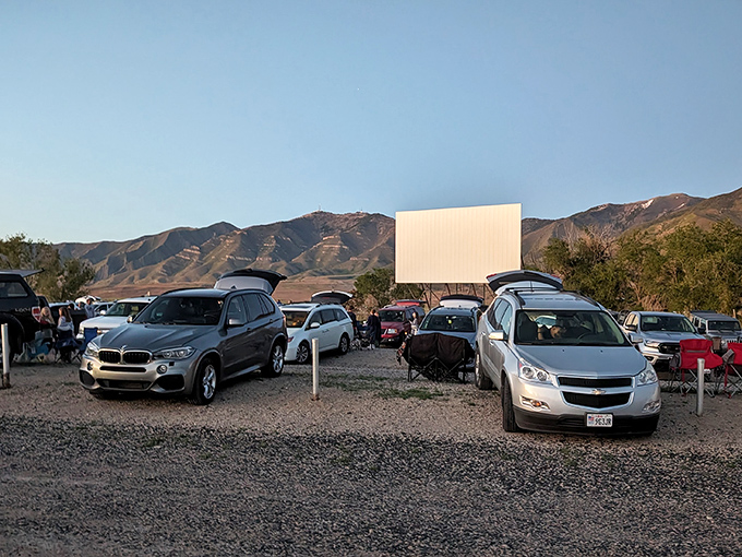 Cars lined up at dusk with the majestic Oquirrh Mountains creating nature's perfect backdrop. Movie magic meets Utah's stunning landscape in one unforgettable frame.