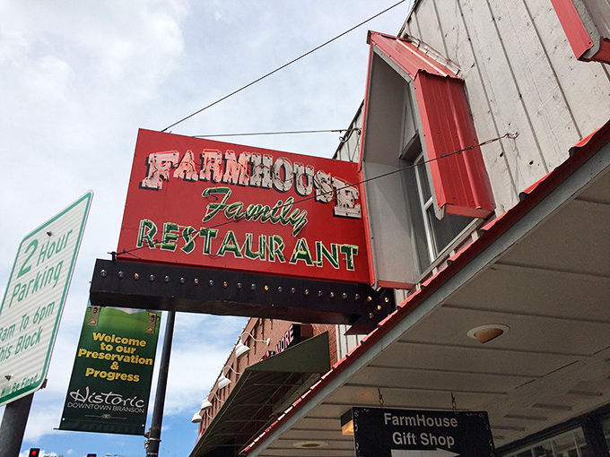Nestled among Branson's bustling streets, the Farmhouse Restaurant's classic storefront has witnessed decades of satisfied diners making the pilgrimage for that legendary peach cobbler.
