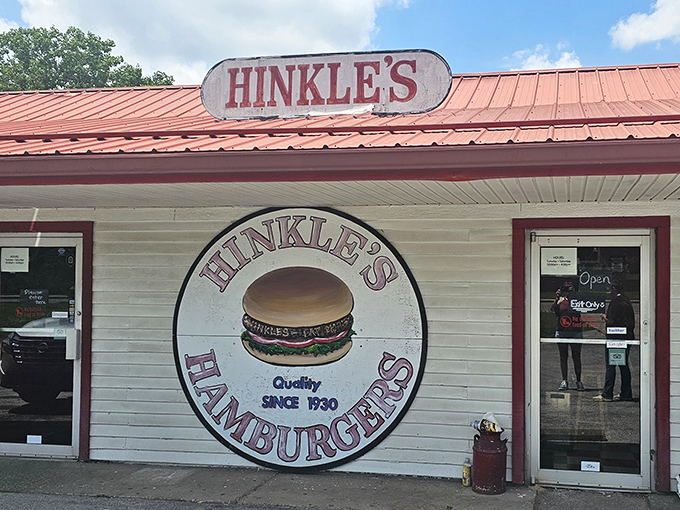 The iconic red-roofed Hinkle's beckons like a burger lighthouse, promising smashed patty perfection since long before "artisanal" became a marketing buzzword.