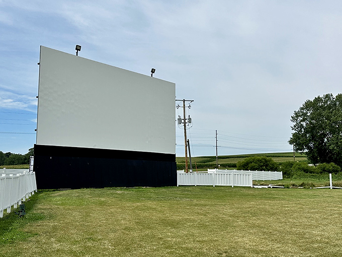 The iconic white screen stands sentinel against Iowa's endless sky, promising cinematic magic as twilight approaches.