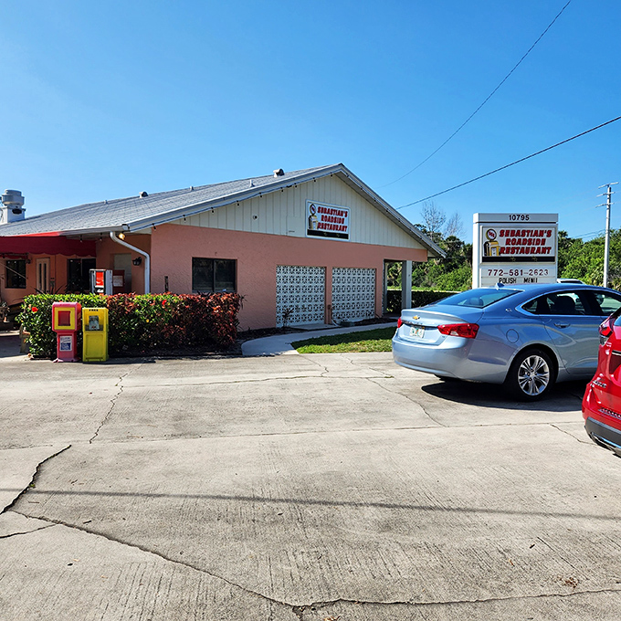 The unassuming pink and white exterior of Sebastian's Roadside Restaurant proves once again that culinary treasures often hide in plain sight.