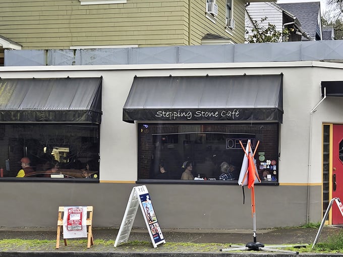 That classic black awning with "Stepping Stone Cafe" written across it isn't trying to impress anyone&mdash;it's too busy promising honest food inside.