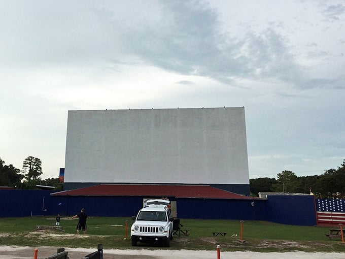 The blank canvas awaits its Hollywood transformation as daylight fades, promising an evening where memories are made between car doors and constellations.