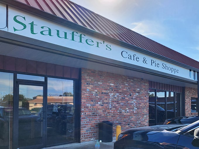 The iconic red roof of Stauffer's Cafe & Pie Shoppe beckons hungry travelers like a lighthouse guiding ships to delicious harbor.