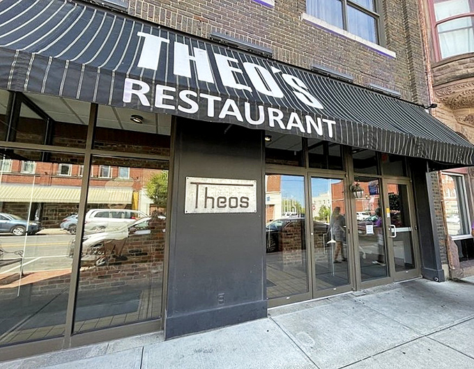 The classic brick fa&ccedil;ade and black awning of Theo's Restaurant stands as Cambridge's culinary landmark &ndash; no neon needed when the food speaks this loudly.