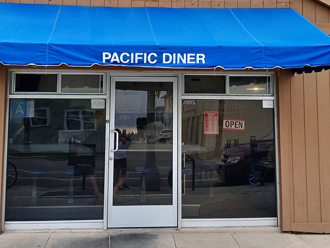 The iconic blue awning of Pacific Diner stands as a beacon of breakfast hope on Pacific Avenue, promising comfort food that's worth the journey.