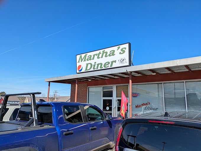 The humble green sign beckons like an old friend. Martha's Diner doesn't need flashy neon when the food inside speaks volumes.