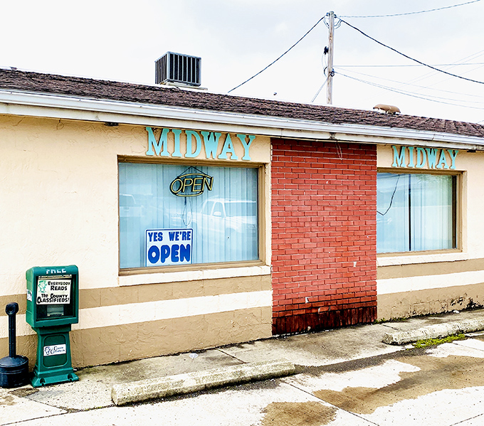 The unassuming exterior of Midway Restaurant proves once again that culinary treasures often hide behind the most modest facades. Those turquoise letters promise more than they show.