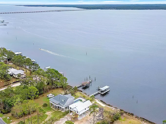 Aerial serenity at its finest. Panacea's waterfront homes perch on stilts like herons, ready for the tide's gentle rhythm.