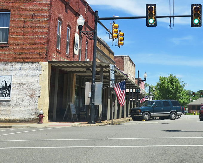 Downtown Ashland welcomes you with classic brick buildings and American flags that flutter like they're genuinely happy to see you arrive.