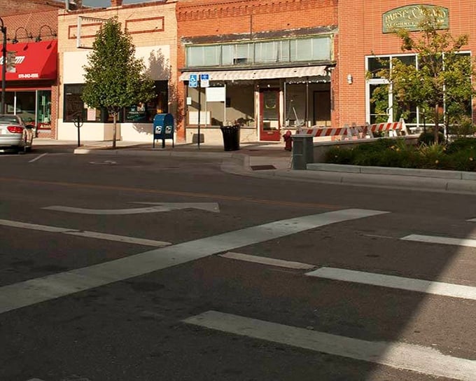 Downtown Brush spreads out like an honest handshake, where brick buildings remember railroad days and nobody's rushing anywhere.