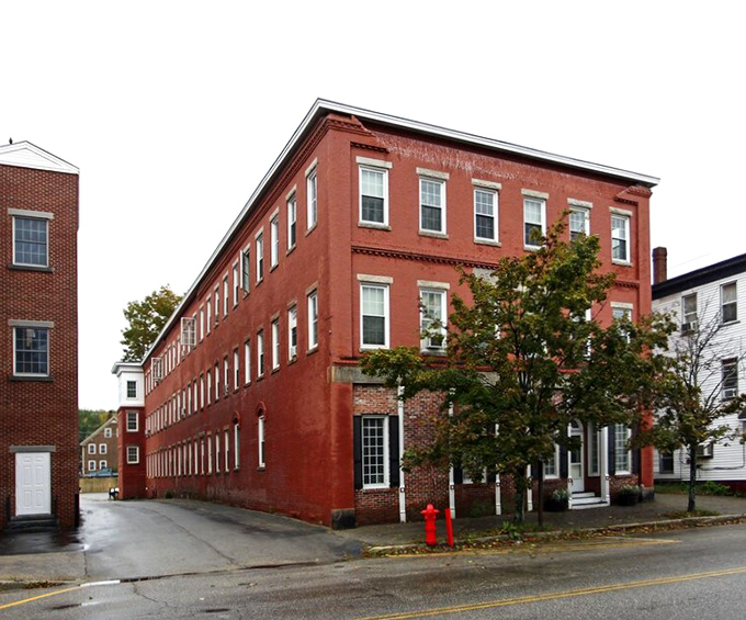Classic New England brick architecture that doesn't just whisper history&mdash;it practically hosts a TED Talk on it. Main Street Farmington keeps commerce cozy and walkable.