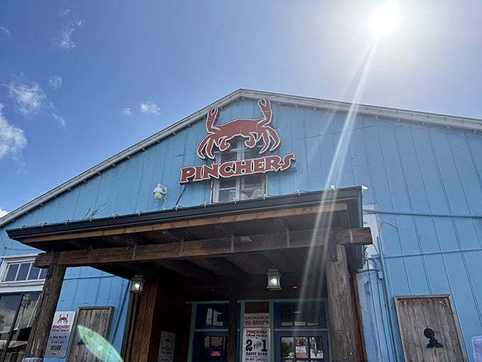 The iconic blue exterior of Pinchers with its cheerful red crab logo stands like a beacon for seafood lovers&mdash;Florida's answer to the Bat-Signal for hungry coastal wanderers.