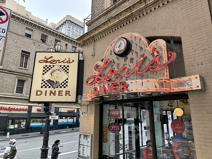 The iconic neon sign of Lori's Diner glows like a beacon of nostalgia on Powell Street, promising comfort food and a trip back in time.