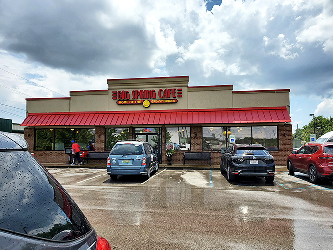 The iconic red awning of Big Spring Cafe beckons hungry travelers like a lighthouse for the famished. This unassuming exterior houses burger greatness within.