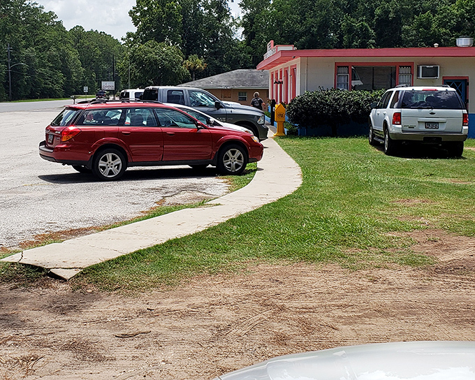 Parked cars tell the real story&mdash;locals know where to eat. That red station wagon probably belongs to someone who's been coming here for decades.