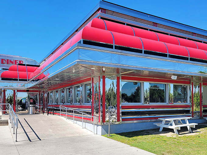 The gleaming chrome exterior of Sunliner Diner shines like a beacon of nostalgia, promising delicious time travel with every meal.
