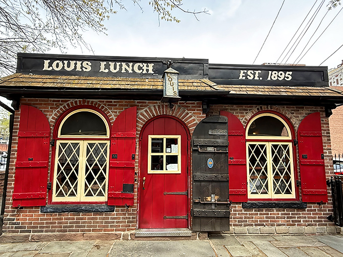 Morning light bathes the historic fa&ccedil;ade in a warm glow, highlighting the diamond-paned windows that have witnessed over a century of hungry customers.