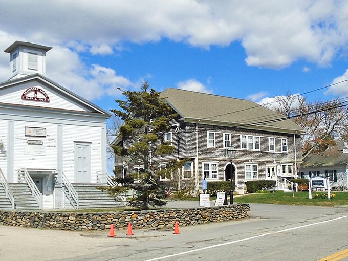 A quiet street in Little Compton showcases timeless charm with classic New England architecture and small-town character that feels like stepping into a Norman Rockwell painting.
