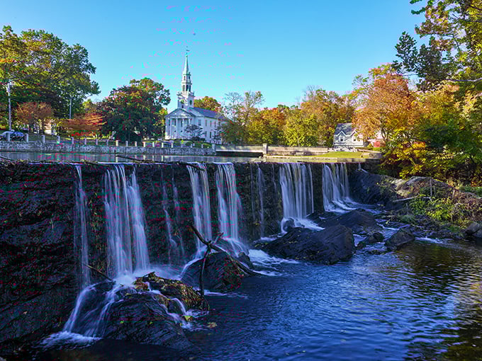 Milford's iconic waterfall and white church steeple create that perfect New England moment where you half expect Paul Revere to gallop through.