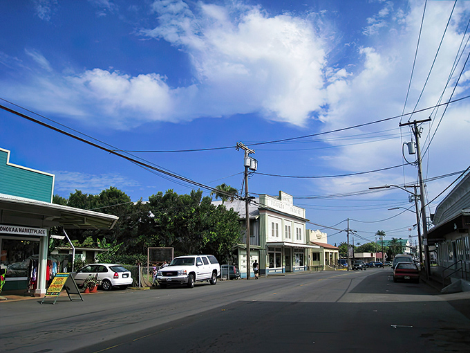 Mamane Street stretches before you like a living postcard, where the sky seems bigger and bluer than anywhere else on the island.
