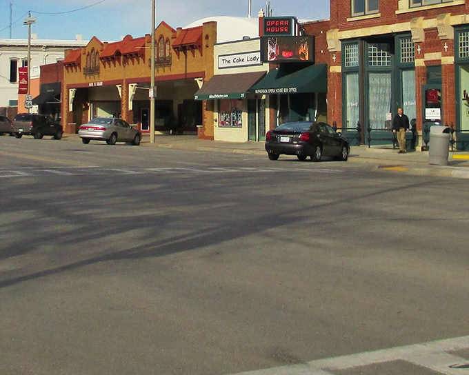 McPherson's Main Street feels like stepping into a Norman Rockwell painting where brick storefronts tell stories and the Opera House stands as cultural guardian.
