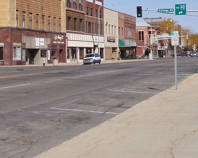 Broadway Avenue stretches before you like a small-town movie set, where rush hour means three cars at a stop sign.
