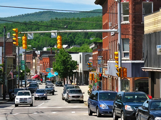 Main Street stretches toward the mountains like a postcard come to life, where brick buildings and small-town charm create New Hampshire's version of Norman Rockwell.