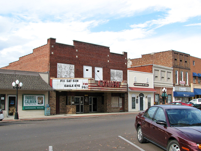 The Court Square Theatre stands as a sentinel of simpler times, when date night meant sharing popcorn instead of Netflix passwords.