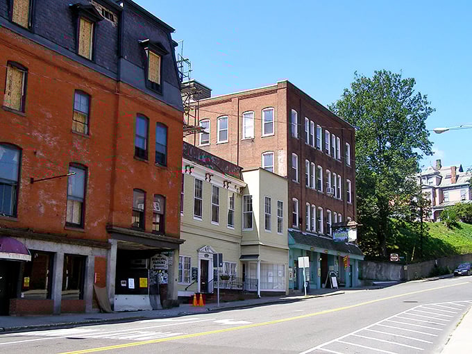 Historic brick buildings line Brattleboro's sloping streets, creating a postcard-perfect downtown where your wallet can breathe easier than in big cities.