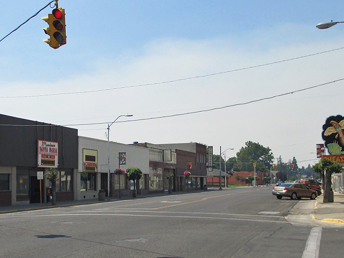 Where smoky haze meets small-town charm, this main street view captures Sunnyside's delightfully leisurely pace of life.