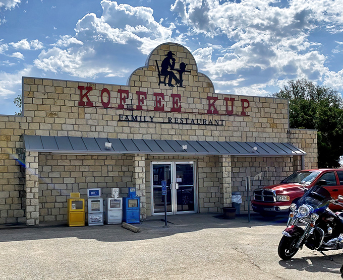 A motorcycle at the door means someone inside knows where the good food lives.