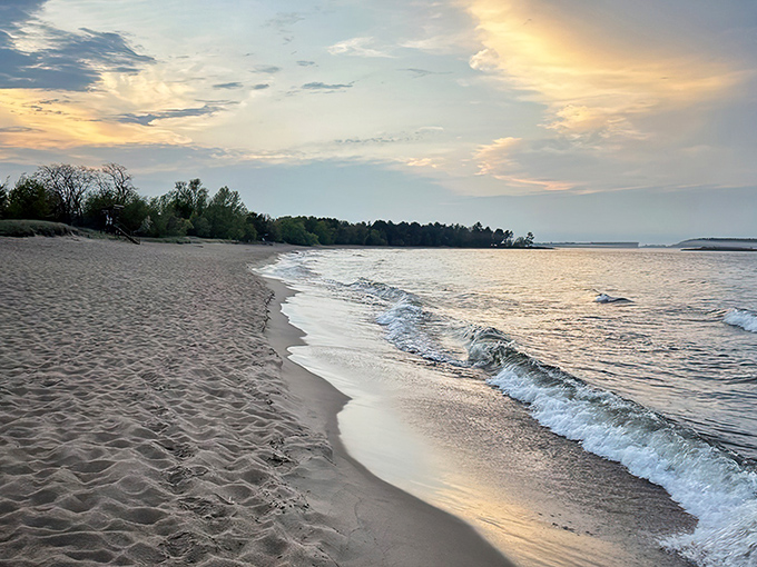 That iconic red lighthouse watching over pristine shores. McCarty's Cove delivers the quintessential Great Lakes experience with a side of postcard perfection.