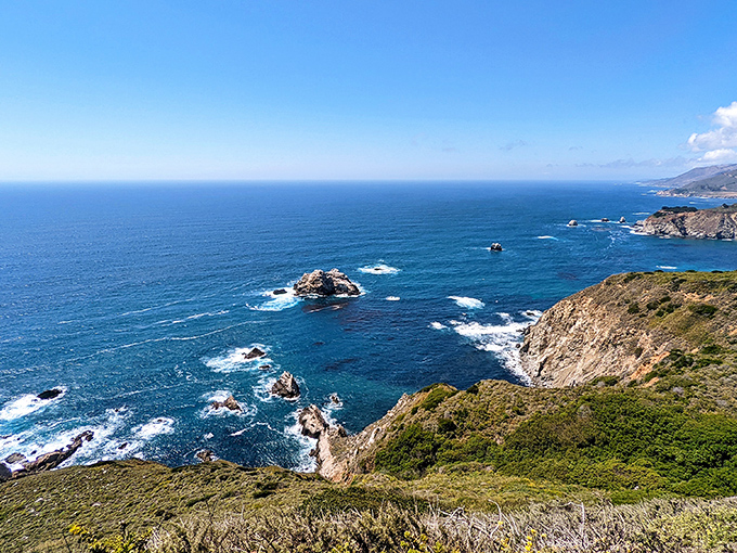 Nature's perfect composition unfolds at Seal Beach Overlook, where river meets ocean in a swirling dance that would make even the most jaded traveler gasp.