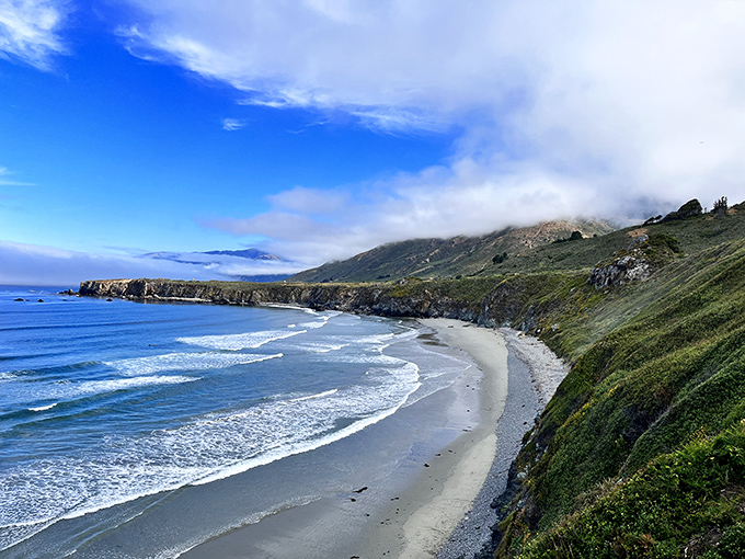 The morning fog performs its daily disappearing act, revealing the jewel-toned waters that make California's central coast a photographer's dream.