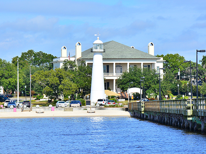 Morning reveals the lighthouse's strategic position, standing like a pristine chess piece against Biloxi's coastal landscape.
