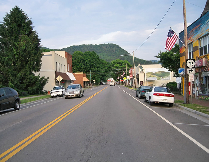 Main Street stretches before you like a welcoming handshake, with mountains standing sentinel in the background. Small-town America at its most authentic.