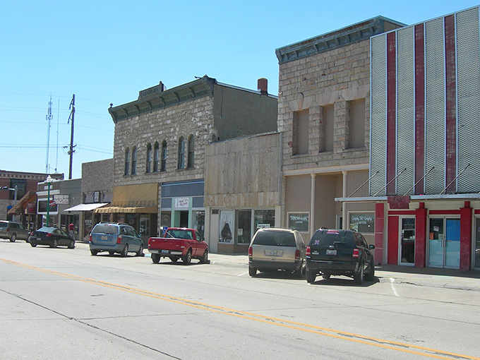 Downtown Valentine showcases classic Americana charm with its brick buildings, fluttering flags, and storefronts that whisper tales of the heartland.