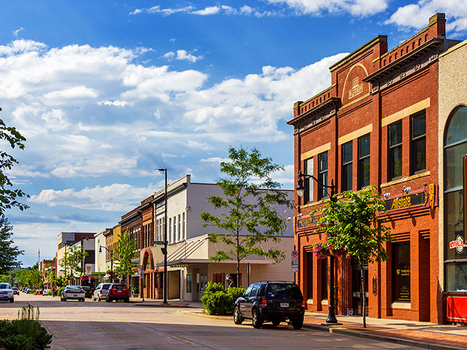 Downtown Eau Claire's historic brick buildings stand as colorful sentinels of the past, while modern developments peek through, creating that perfect "then meets now" vibe.