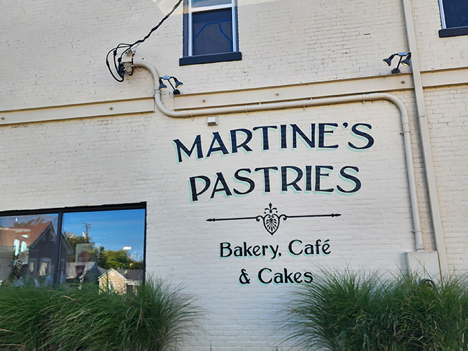 The classic cream-colored brick exterior of Martine's Pastries announces itself with understated elegance, like a whispered promise of buttery delights within.