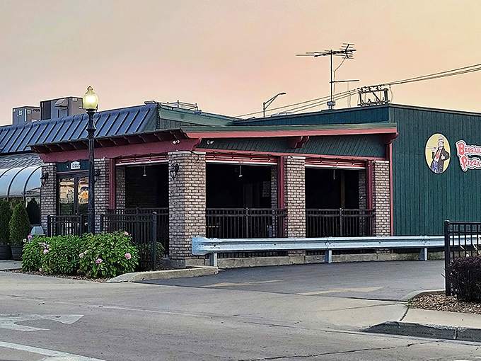 The unassuming exterior of Beggars Pizza in Blue Island &ndash; where architectural modesty meets pizza magnificence. Like finding a diamond in your uncle's old fishing vest.