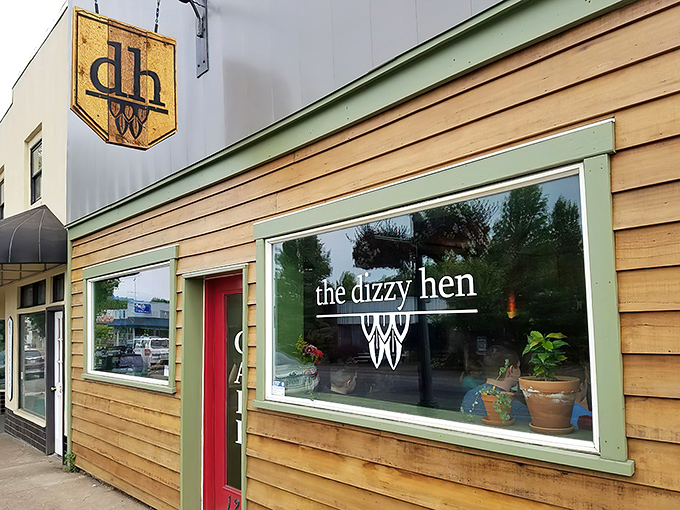 The unassuming wooden exterior of The Dizzy Hen belies the culinary magic happening inside. Small-town charm with big-city flavor awaits behind that red door.