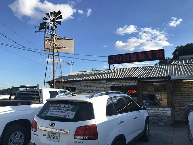 The iconic windmill stands sentinel over Johnny's, a Texas landmark that promises authentic flavors without the fuss. That metal roof has sheltered generations of happy, well-fed Texans.