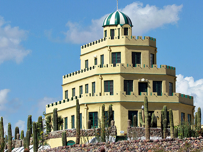 Like a wedding cake dropped in the desert, Tovrea Castle rises majestically above a sea of cacti, its cream-colored tiers defying the harsh landscape.