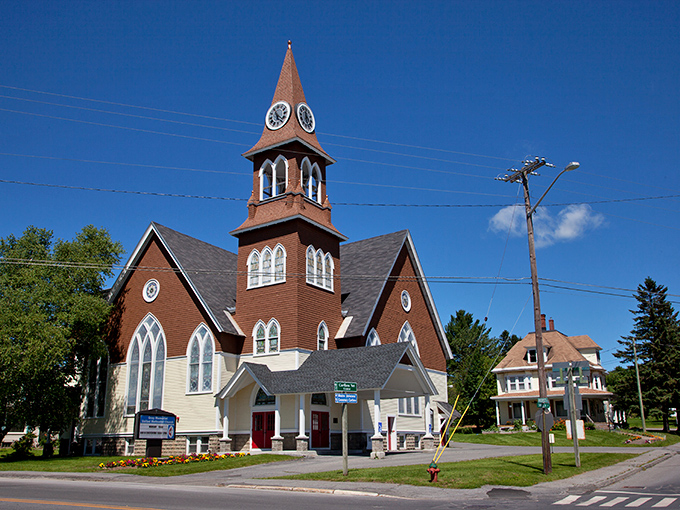 The historic church with its distinctive copper steeple stands as Caribou's architectural crown jewel, reaching skyward like the community's spirits.