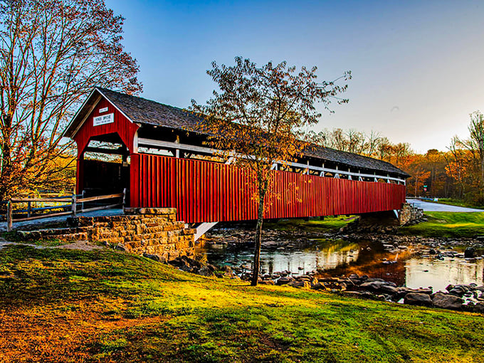 King's Covered Bridge stands proudly in autumn splendor, its crimson siding practically winking at photographers who've discovered this hidden Somerset County treasure.