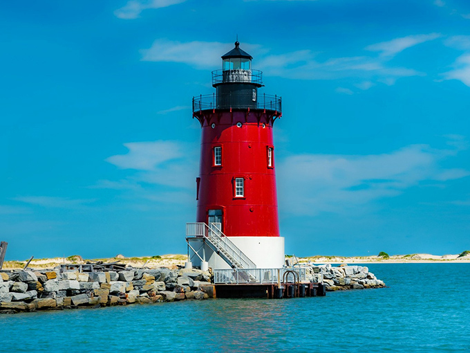 The crimson sentinel stands tall against the azure Delaware sky, a maritime masterpiece that's been Instagram-worthy since long before Instagram existed.