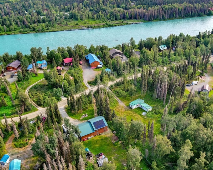 Aerial paradise where turquoise waters meet emerald forests &ndash; Soldotna's riverside cabins offer front-row seats to Alaska's greatest show on earth.