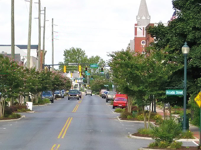 Arcadia Street welcomes you with tree-lined charm and that church steeple standing tall like the town's unofficial exclamation point.